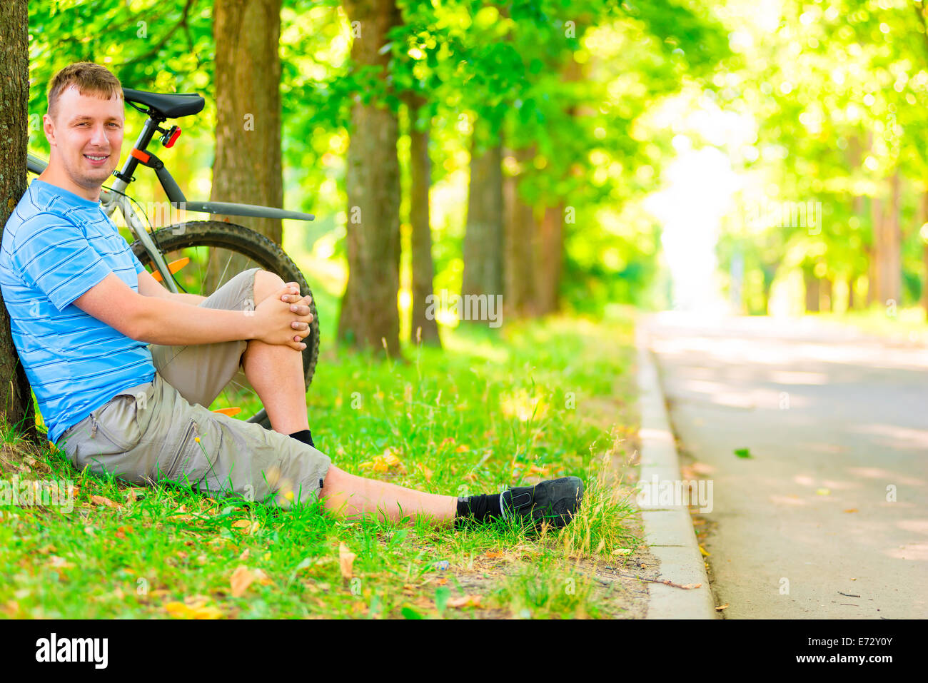 Resting against tree hi-res stock photography and images - Alamy