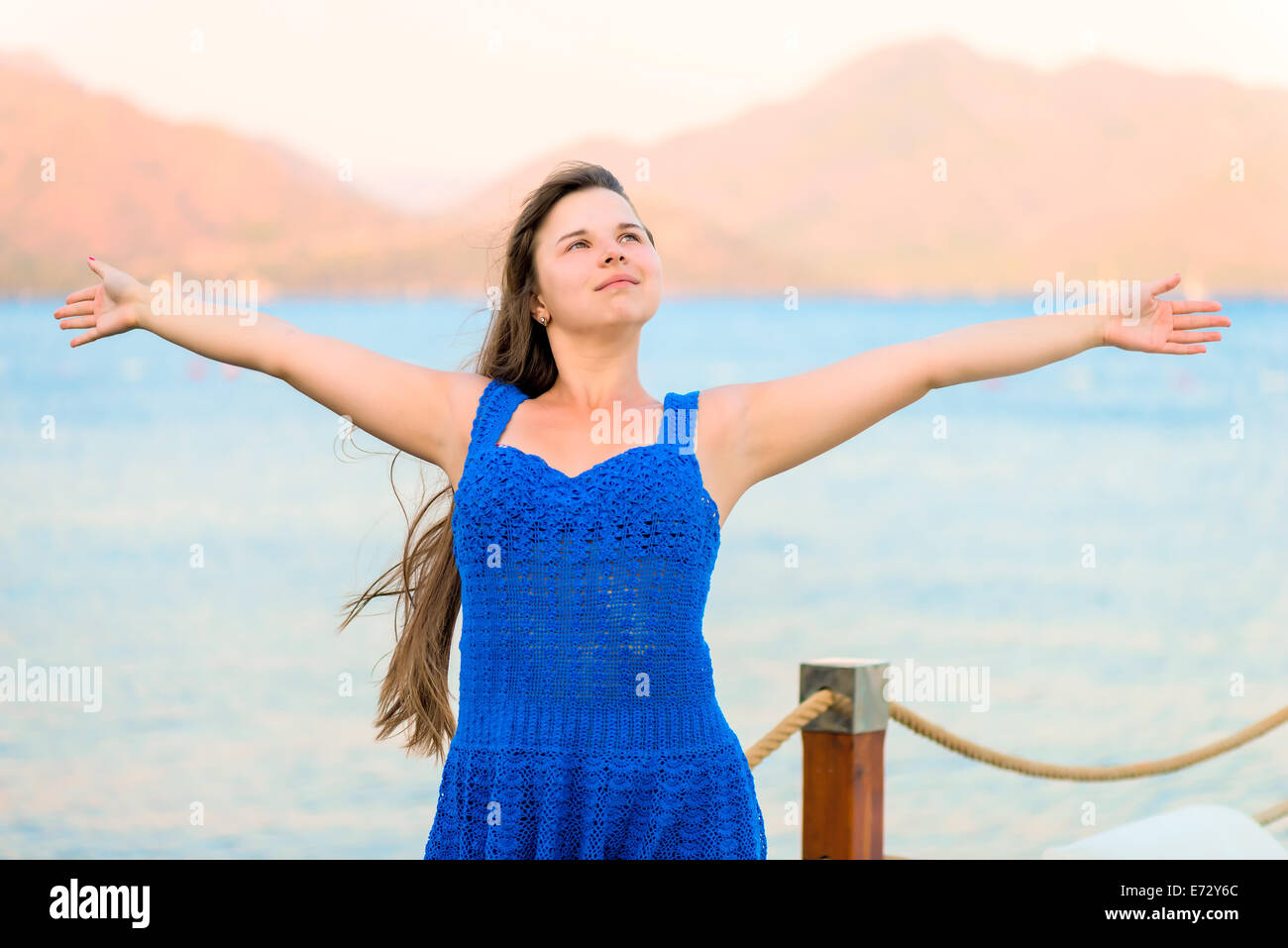 beautiful brunette woman with outstretched hands Stock Photo - Alamy