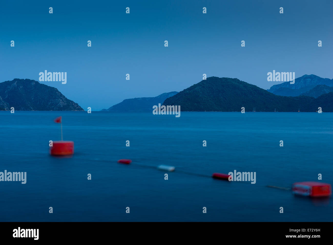 gloomy evening seascape with Mountain View Stock Photo - Alamy