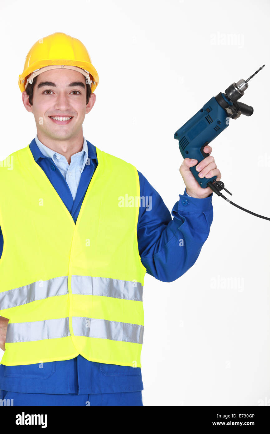 Construction worker with a drill Stock Photo - Alamy