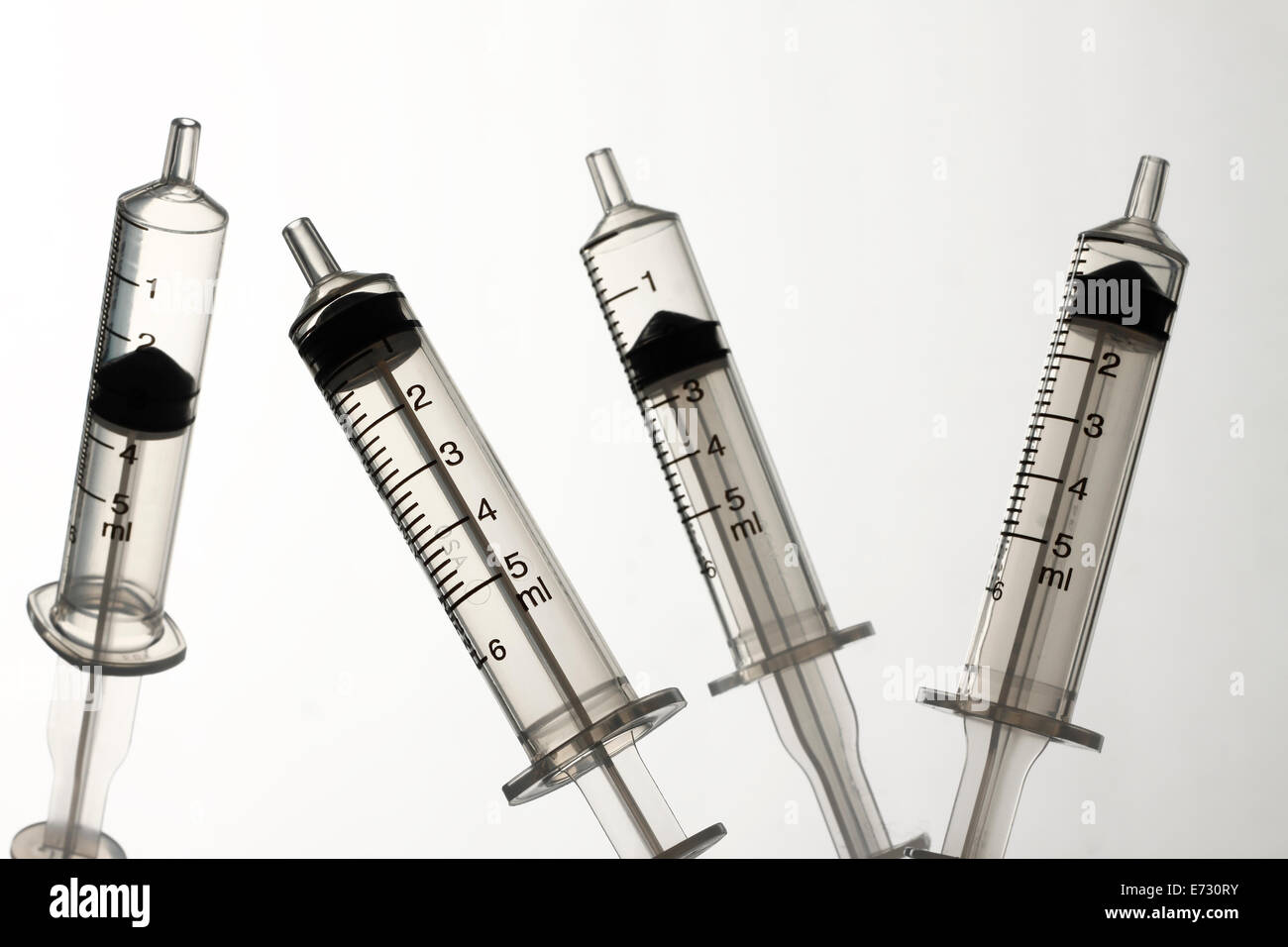 a group of syringe on white background Stock Photo - Alamy