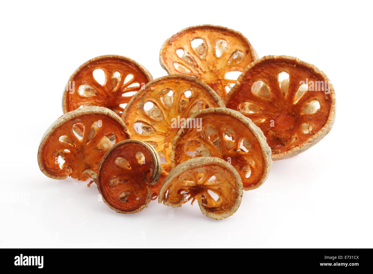 Slices of dried bael fruit on white background Stock Photo - Alamy