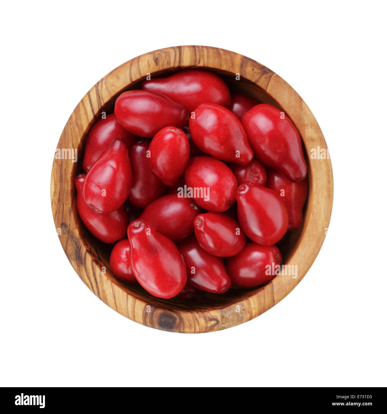 ripe cornel berries in wood bowl, isolated on white background Stock ...