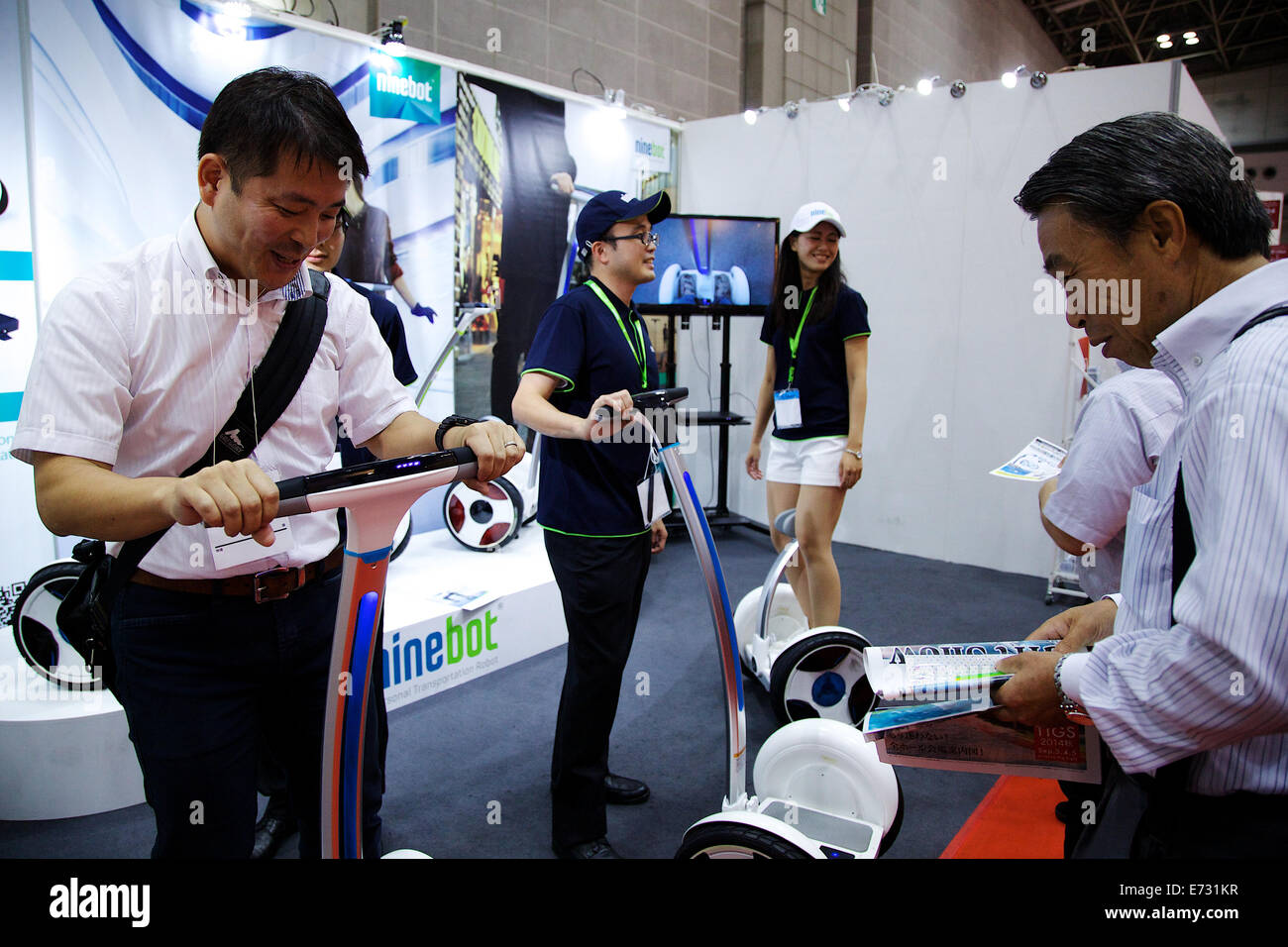 A visitor uses the "Ninebot" product at the Gift Show exhibition in ...