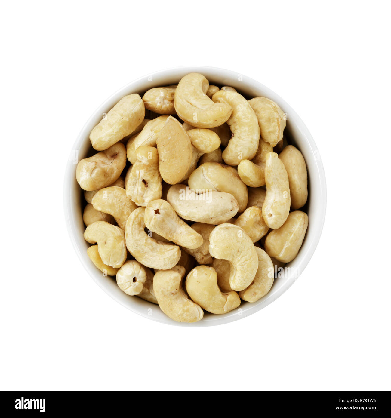 heap of dry cashew nuts in bowl, on white background from above Stock ...