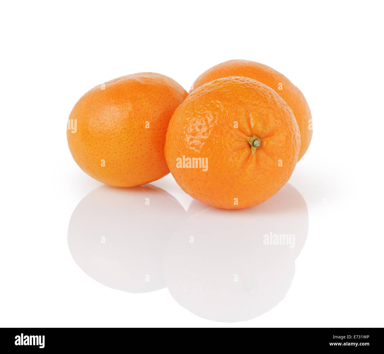 three ripe tangerines, isolated on white background Stock Photo - Alamy
