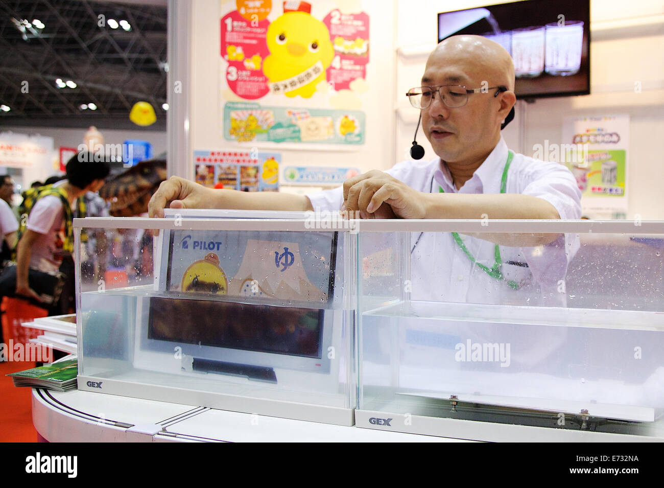 Exhibitor shows to visitor his original products during the Gift Show ...