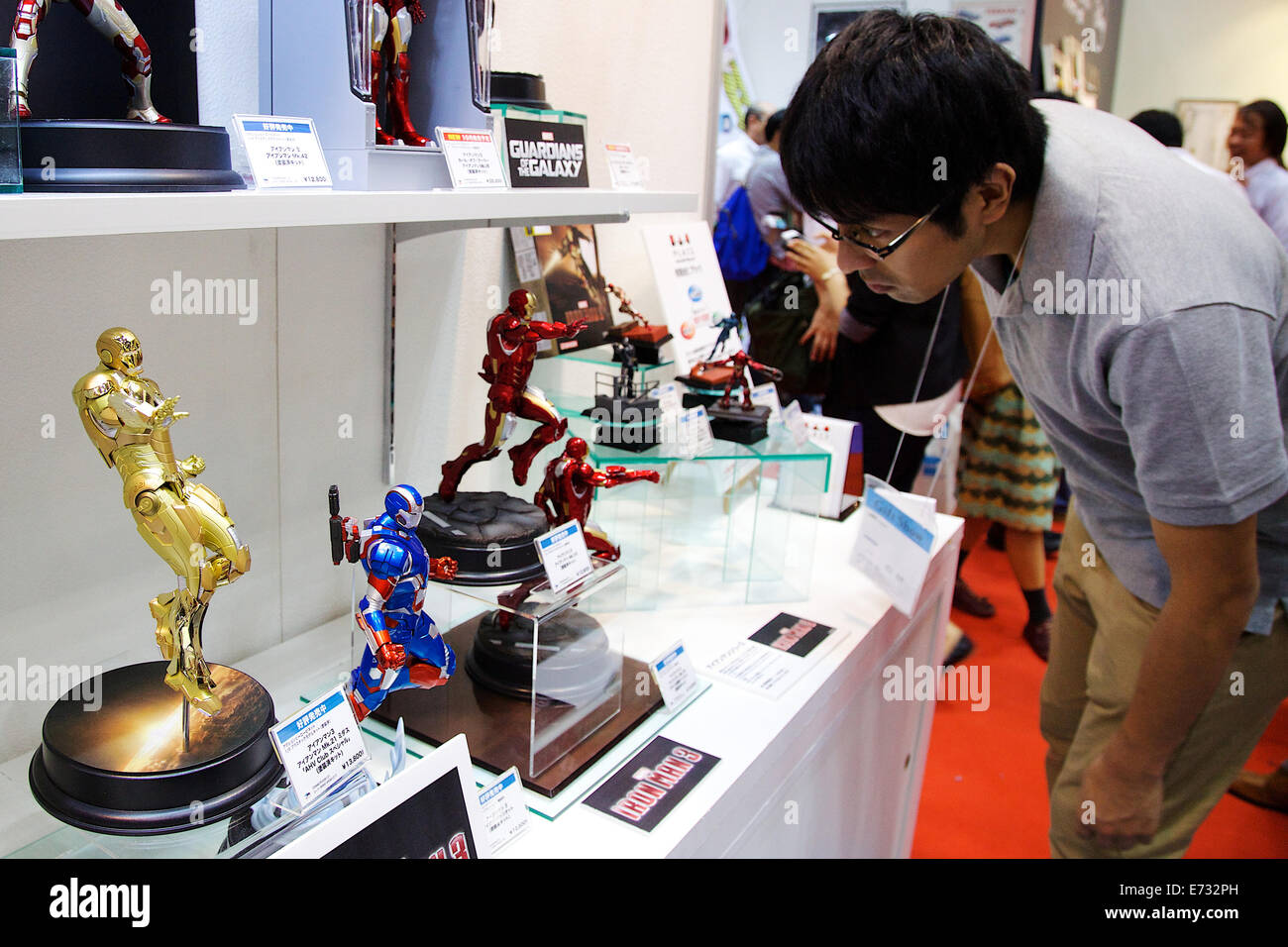 A visitor sees the action figures of the movie Iron Man 3 at the Gift ...