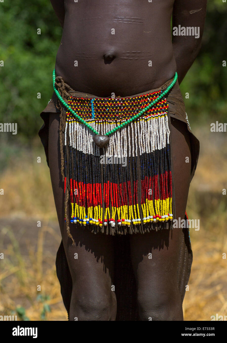 Portrait Of A Nyangatom Tribe Girl With Traditional Beaded Skirt, Omo ...