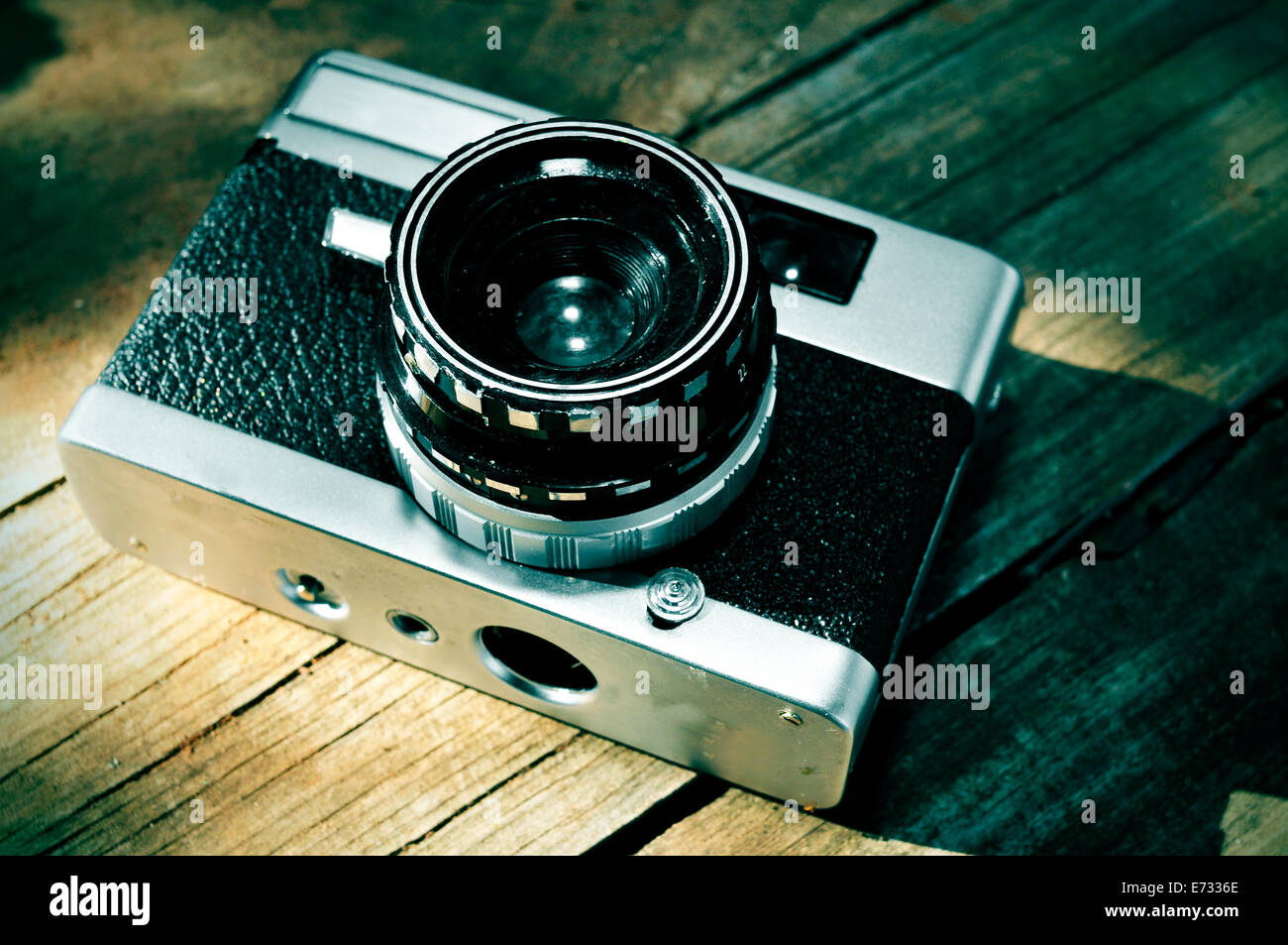 an old camera on a rustic wooden surface Stock Photo - Alamy