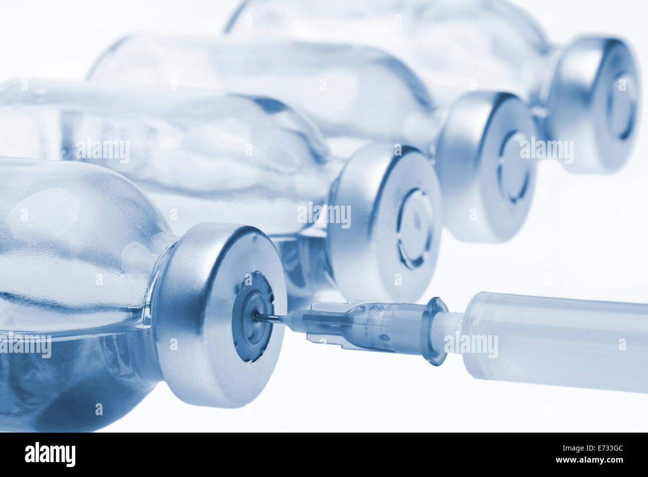 Glass Medicine Vials and Syringe on a white background Stock Photo - Alamy