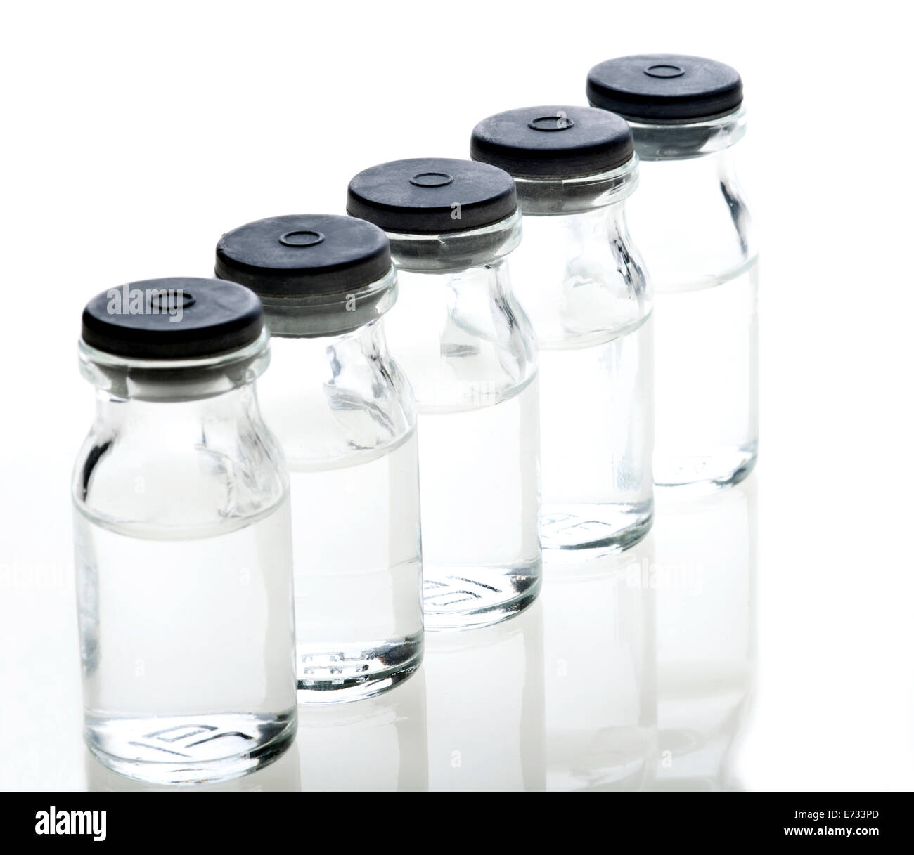 Glass Medicine Vials with liquid on a white background Stock Photo - Alamy