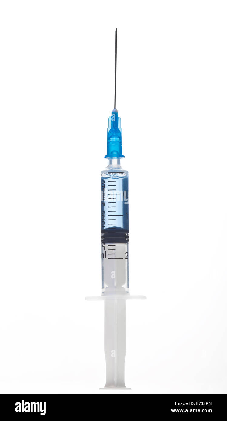 Syringe with blue liquid on a white background Stock Photo - Alamy