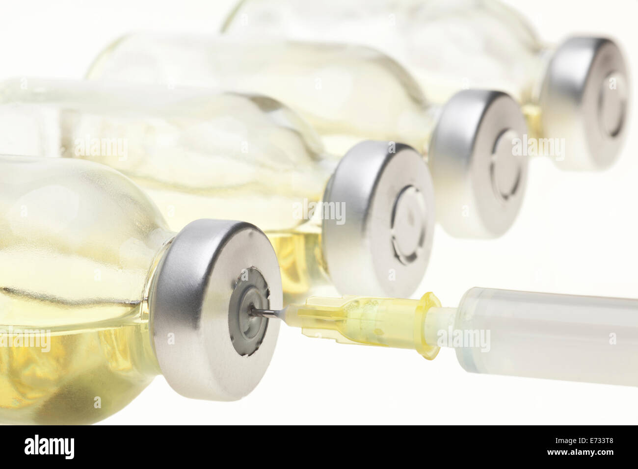 Glass Medicine Vials and Syringe on a white background Stock Photo - Alamy