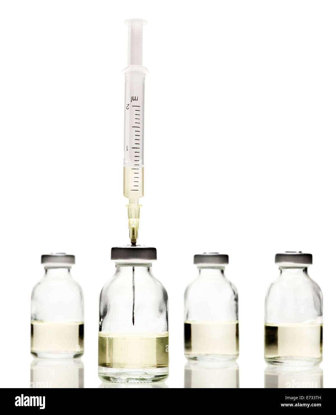 Glass Medicine Vials and Syringe on a white background Stock Photo - Alamy