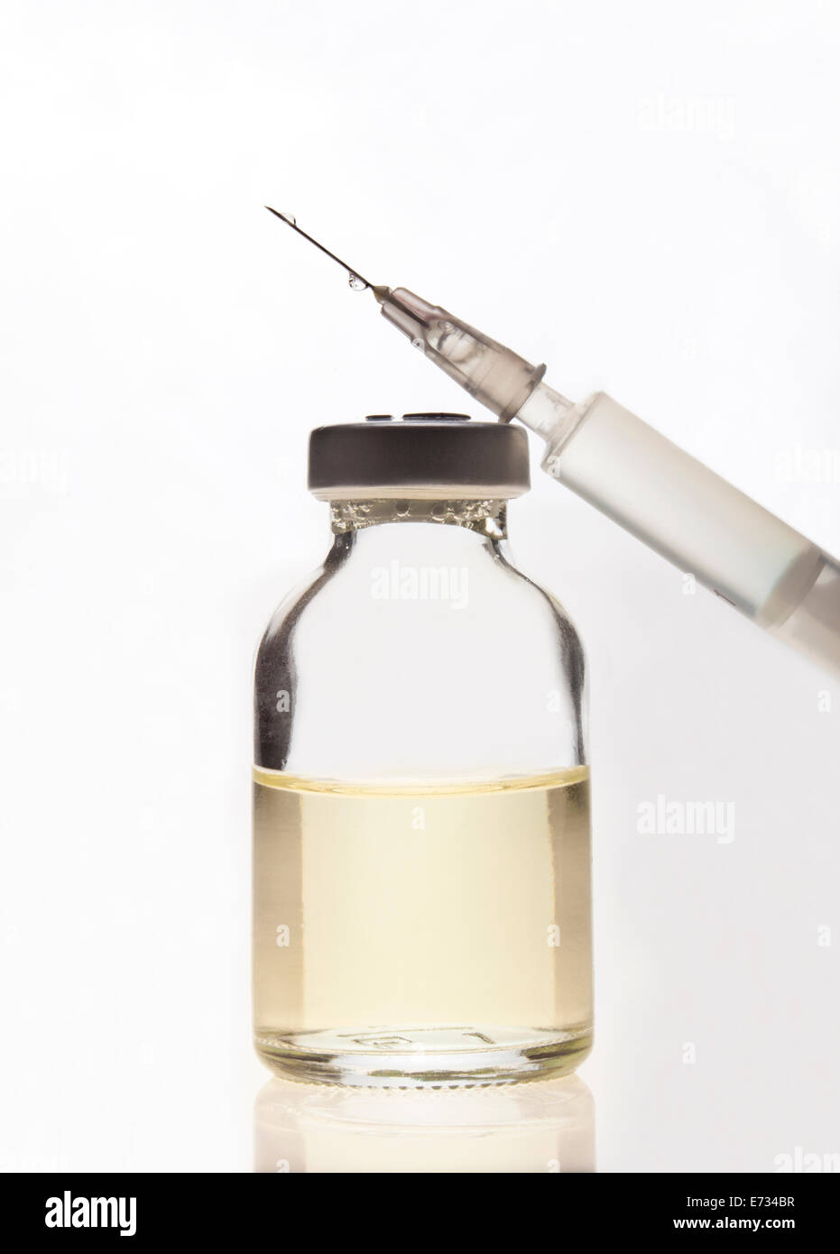 Glass Medicine Vial and Syringe on a white background Stock Photo - Alamy