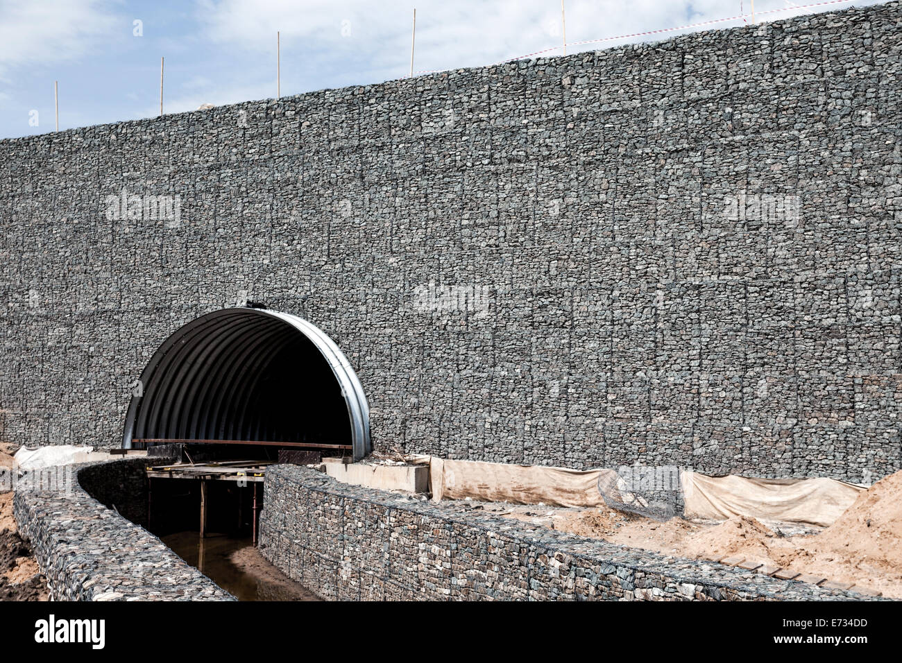 Erosion protection by gabions with tube under the road Stock Photo - Alamy