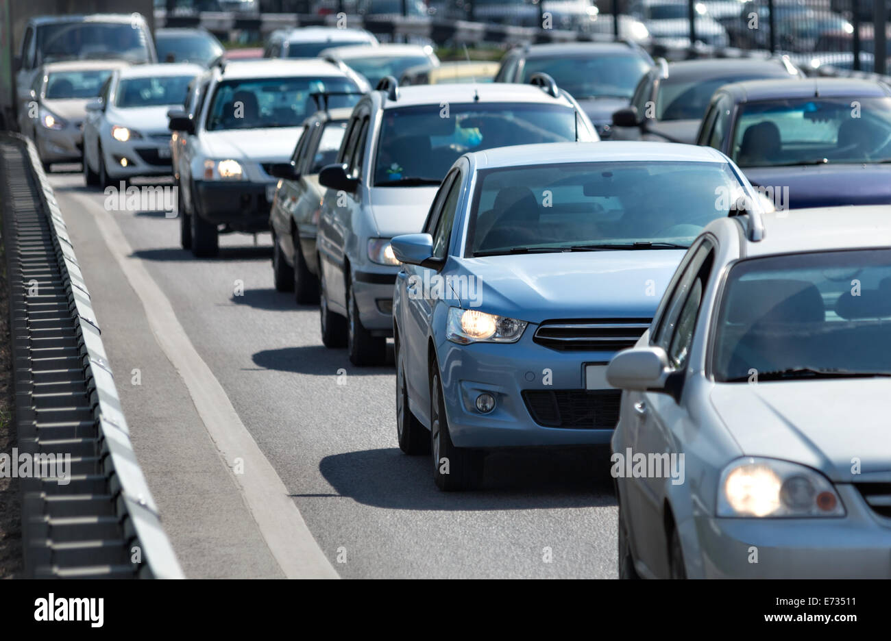 Lots of cars standing in the queue at roadway Stock Photo - Alamy