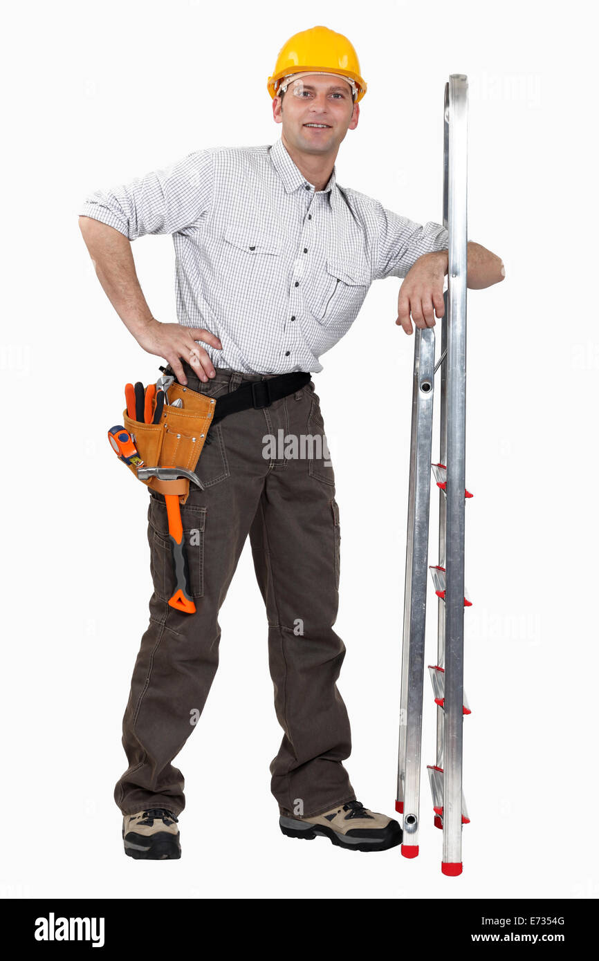 Tradesman leaning against a stepladder Stock Photo - Alamy