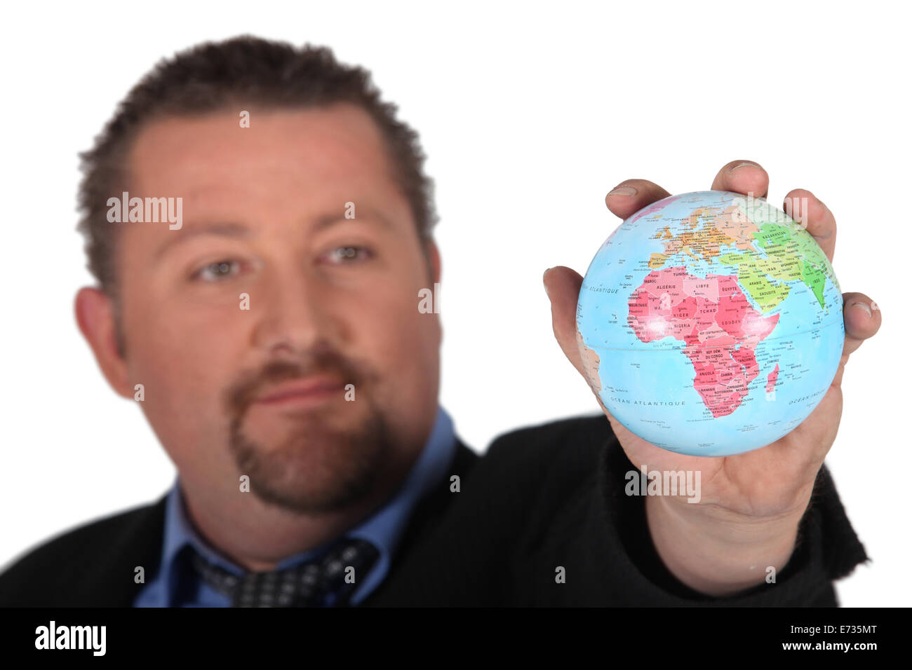 Man holding the world in the palm of his hand Stock Photo - Alamy