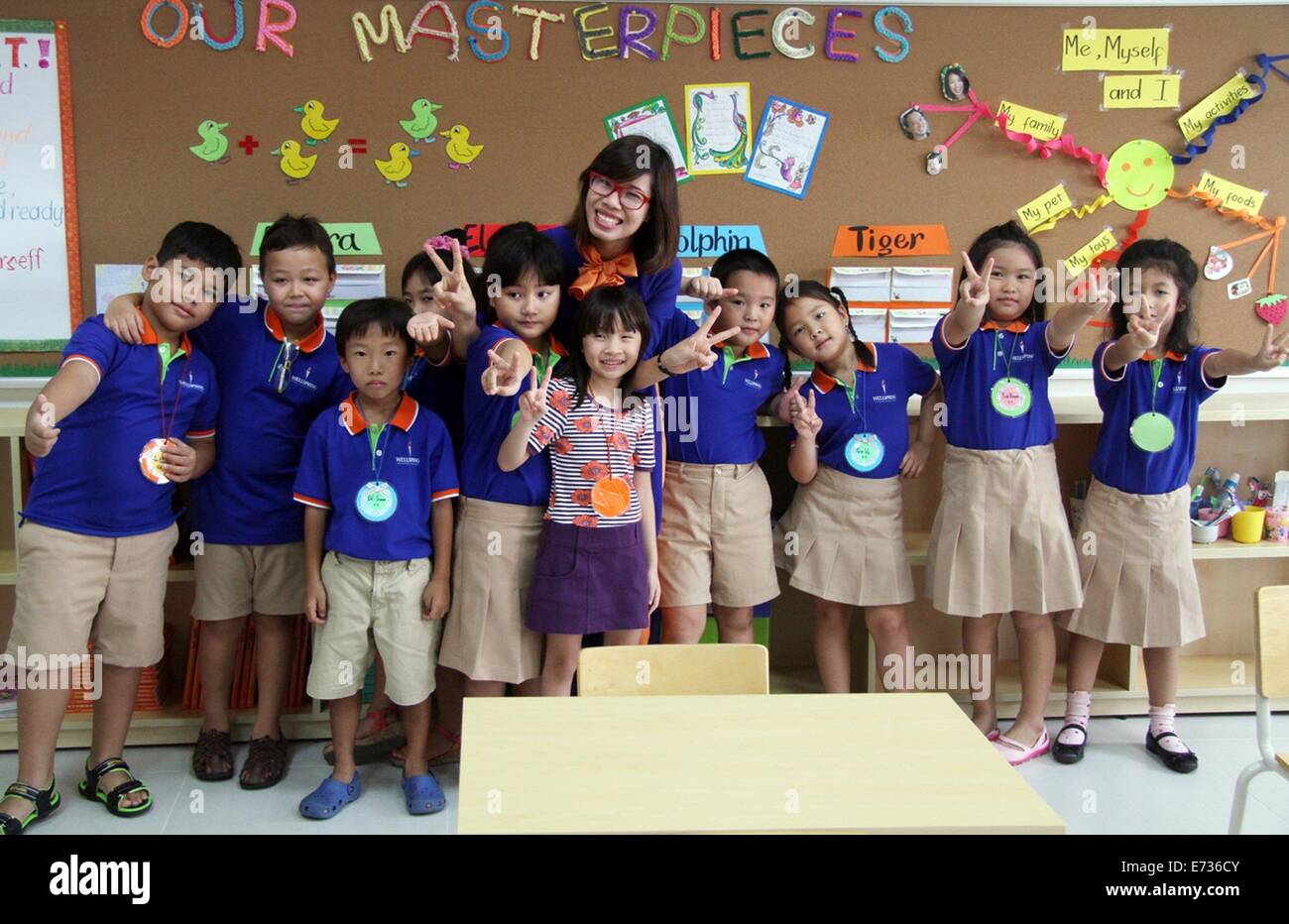 Ho Chi Minh, Vietnam. 5th Sep, 2014. A teacher and students of ...