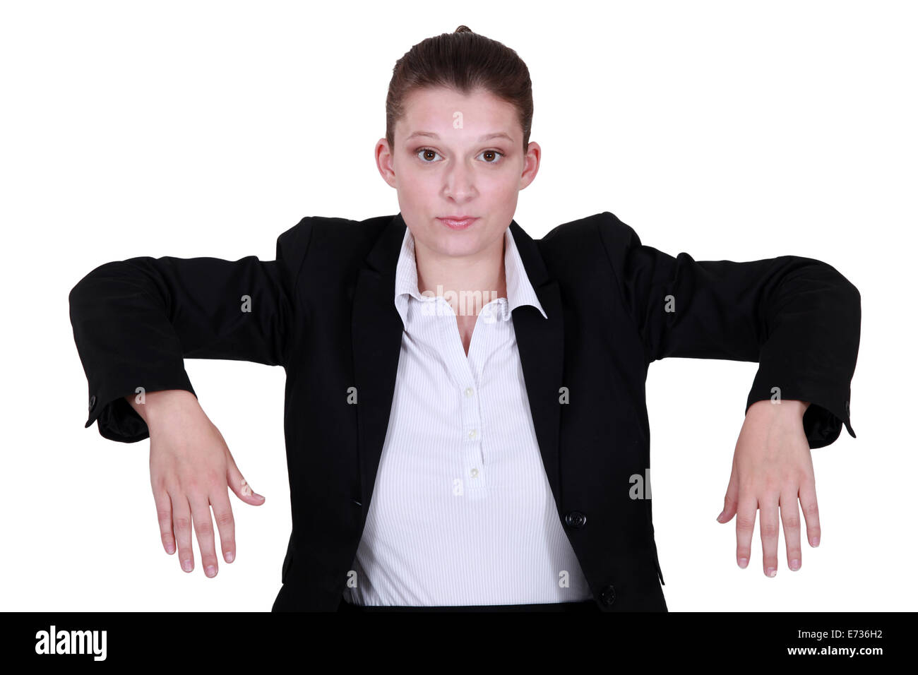 young businesswoman with arms apart resting on imaginary sofa Stock ...
