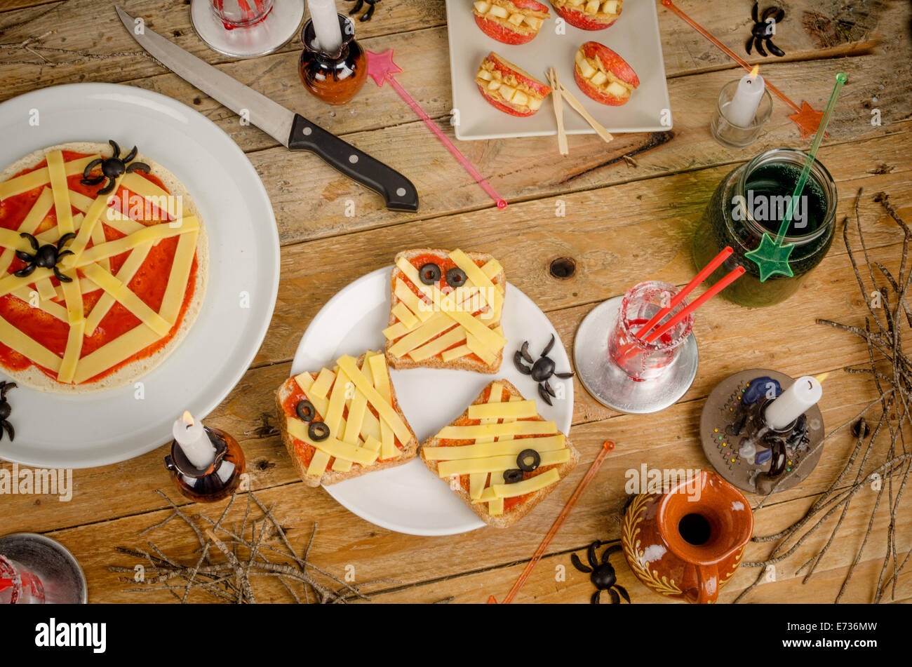 Halloween party table with assorted spooky snacks Stock Photo - Alamy