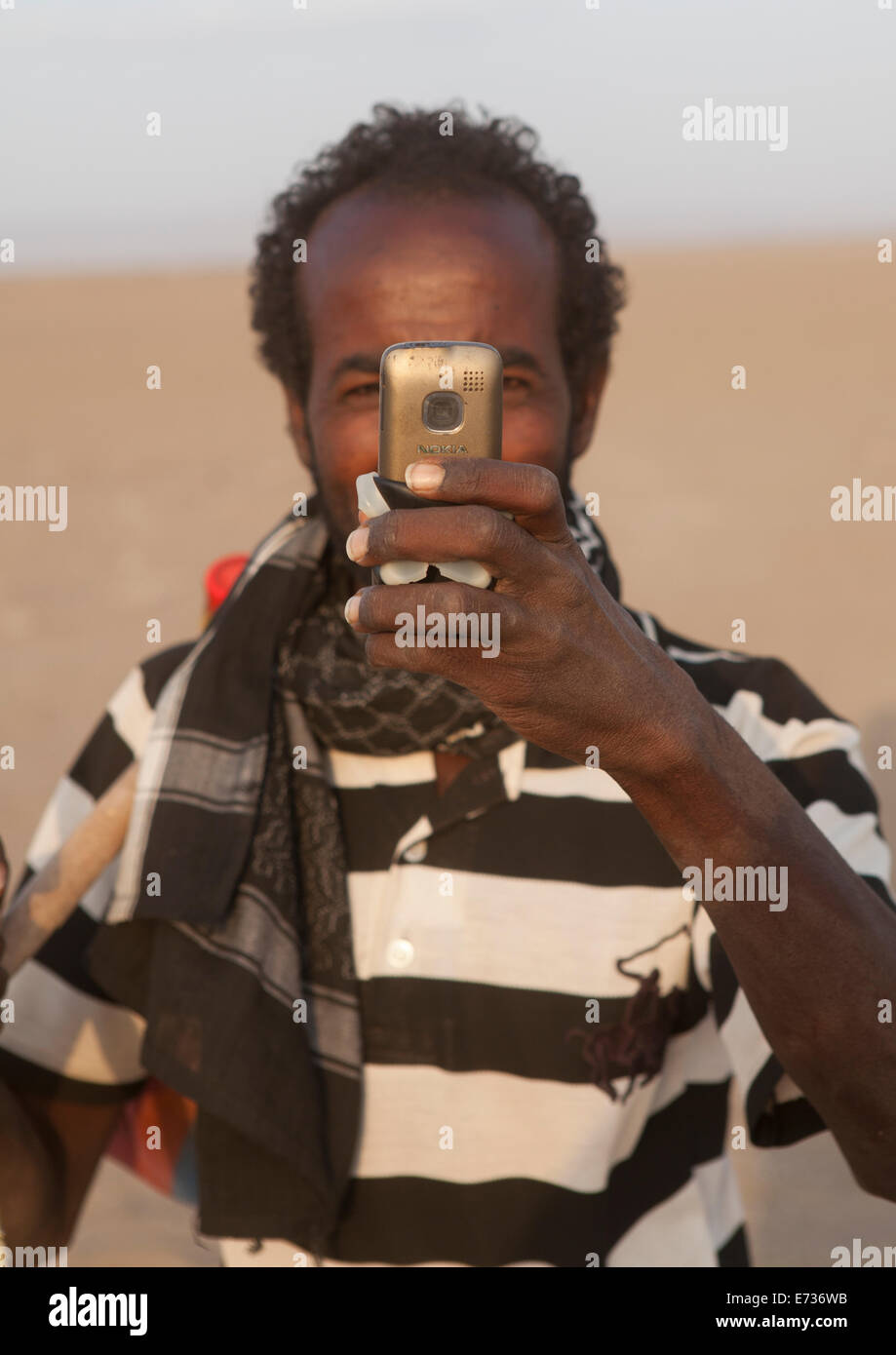 Afar Tribe Man Taking A Picture With His Mobile Phone, Assayta ...