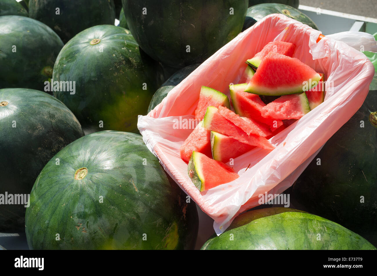 Full frame take of watermelons on display on a street market stall ...