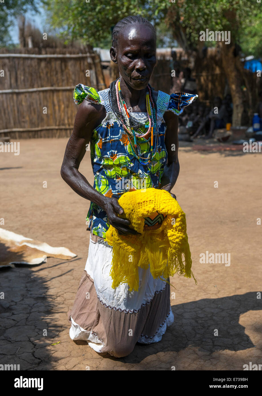 Anuak Tribe Woman Serving Food In The Tradtiional Way By Walking On Her ...