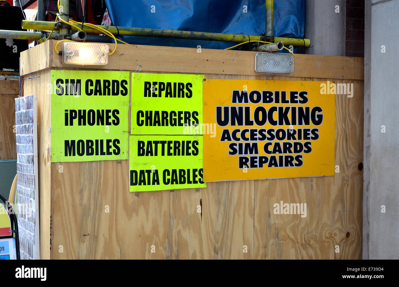 London, England, UK. Temporary signs outside mobile phone shop in ...