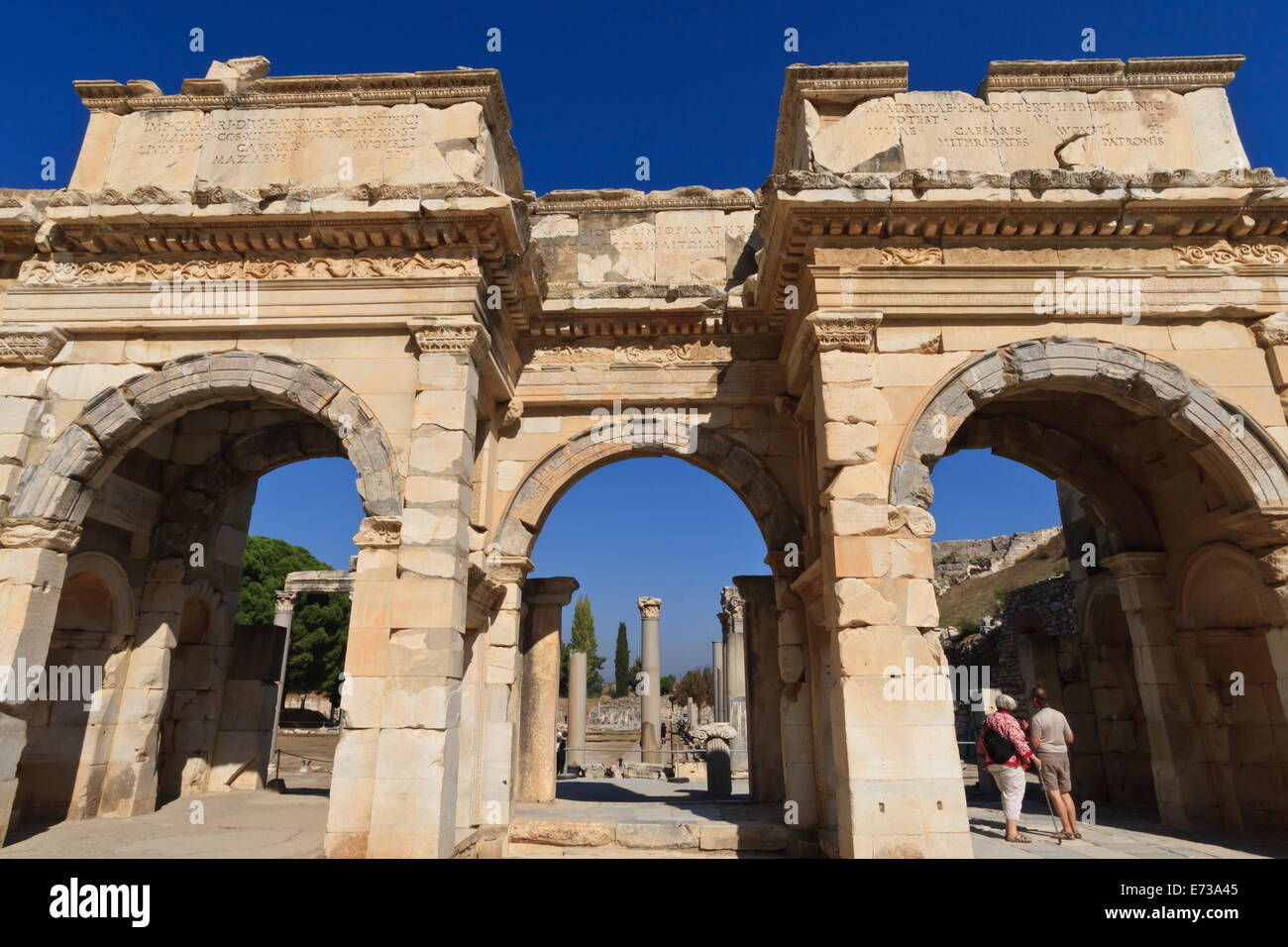 Couple at Mazeus and Mithriadates Gate, Roman ruins of ancient Ephesus ...