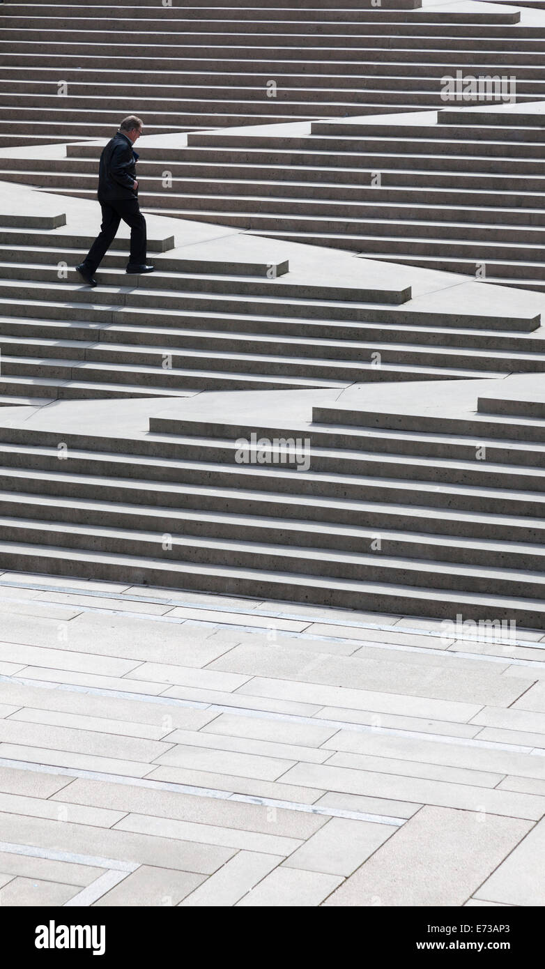 Figure going up stairs hi-res stock photography and images - Alamy