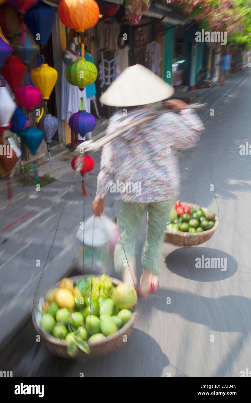 Woman carrying fruit hi-res stock photography and images - Alamy