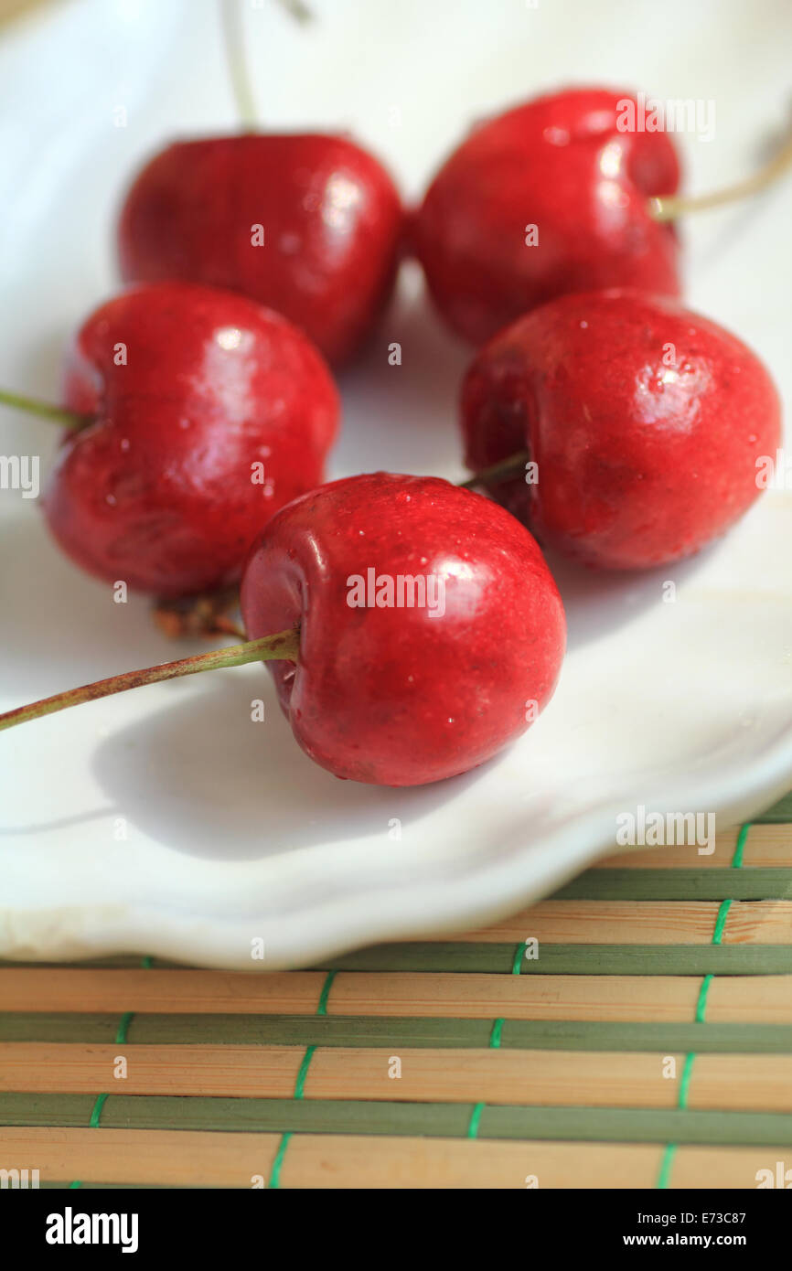 Cherries in the plate Stock Photo - Alamy