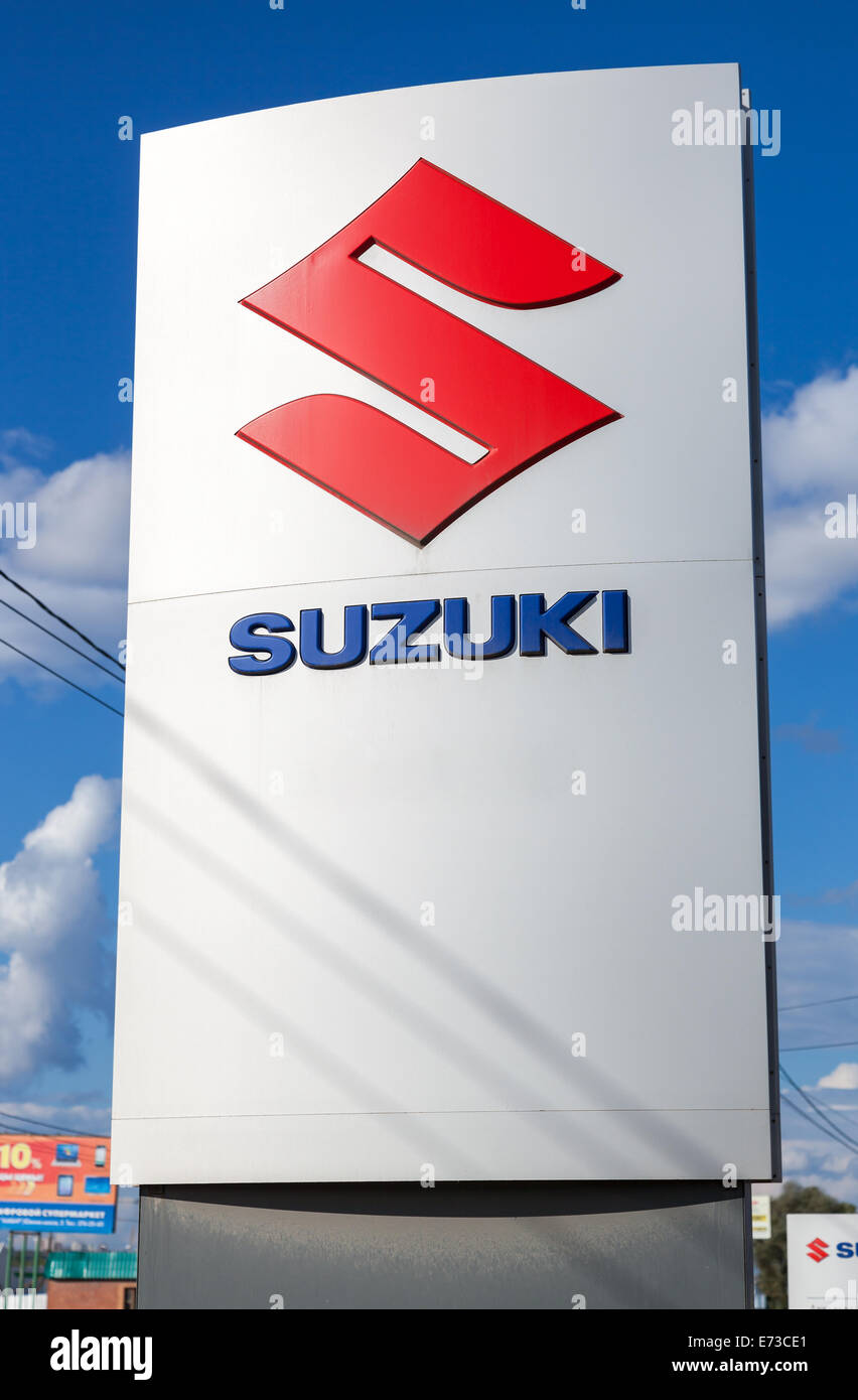 Suzuki dealership sign against blue sky Stock Photo - Alamy