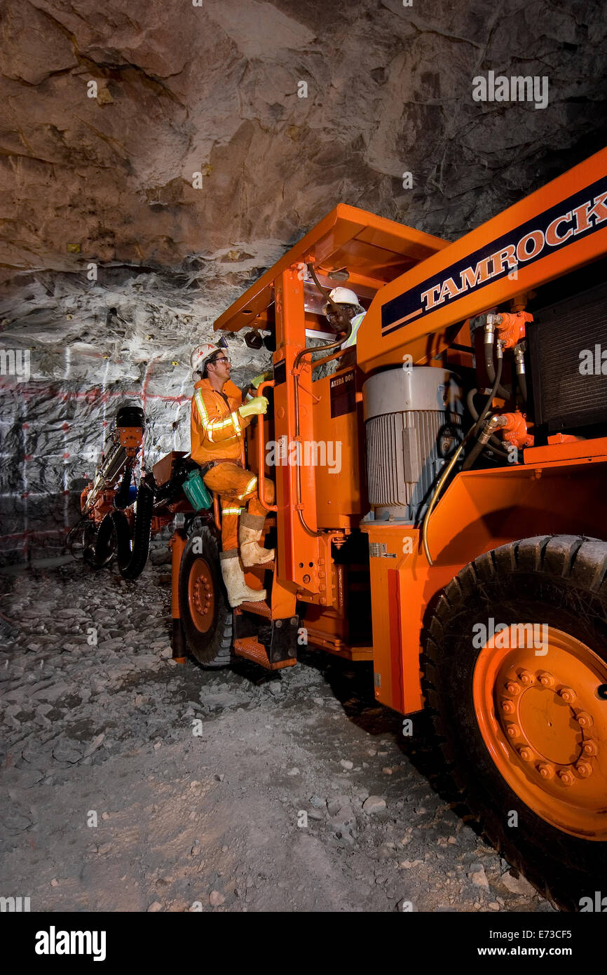 Placing Tamrock drill rig into position before drilling blast holes in ...