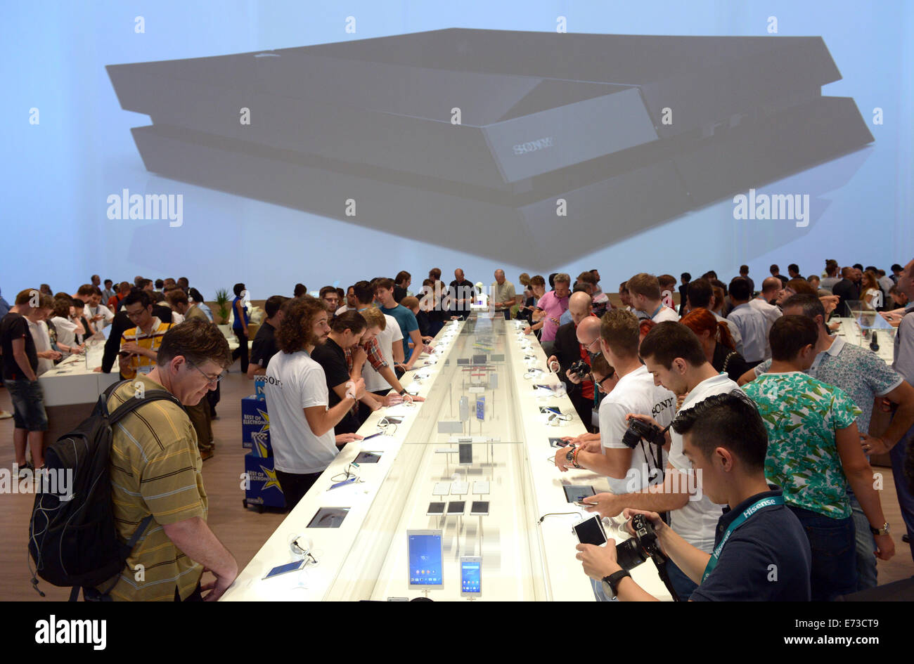 Berlin, Germany. 5th Sep, 2014. Visitors look at new smartphones at the ...
