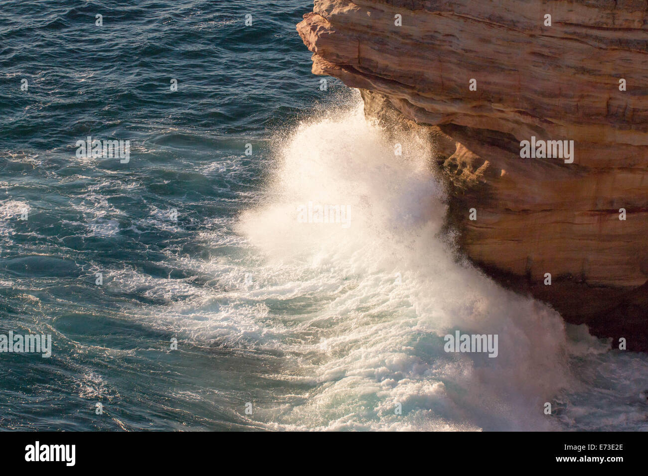 Surf On Coastal Rock Stock Photo - Alamy