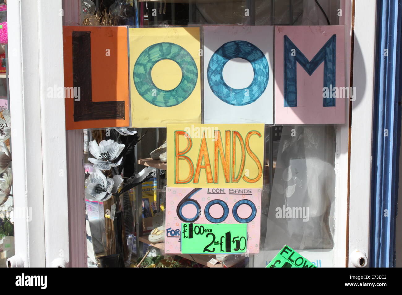 loom bands sign notice in shop window in wales great britain uk Stock ...