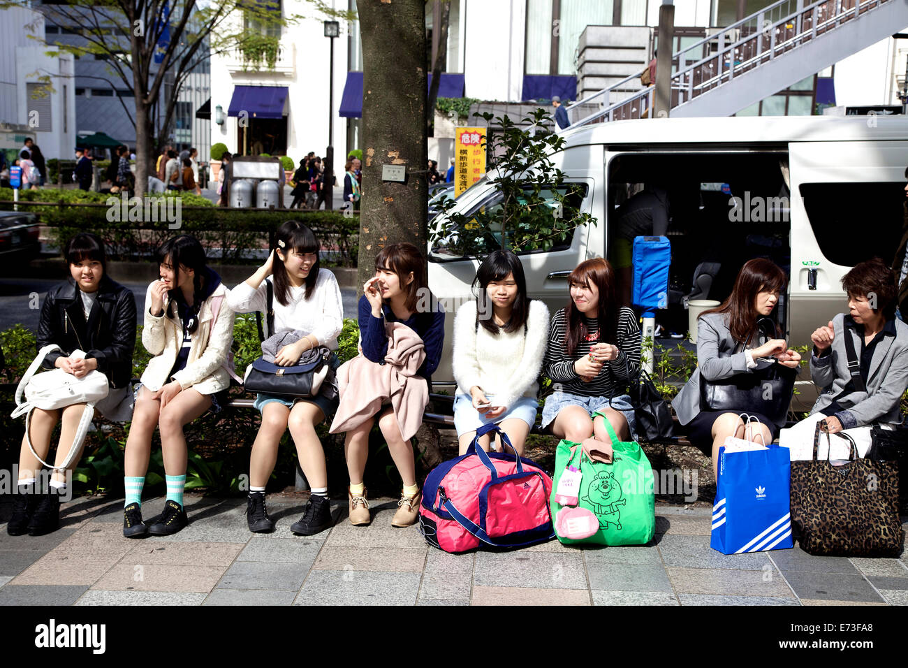 Young people, women, girls, teens, teenagers waiting in line for ...