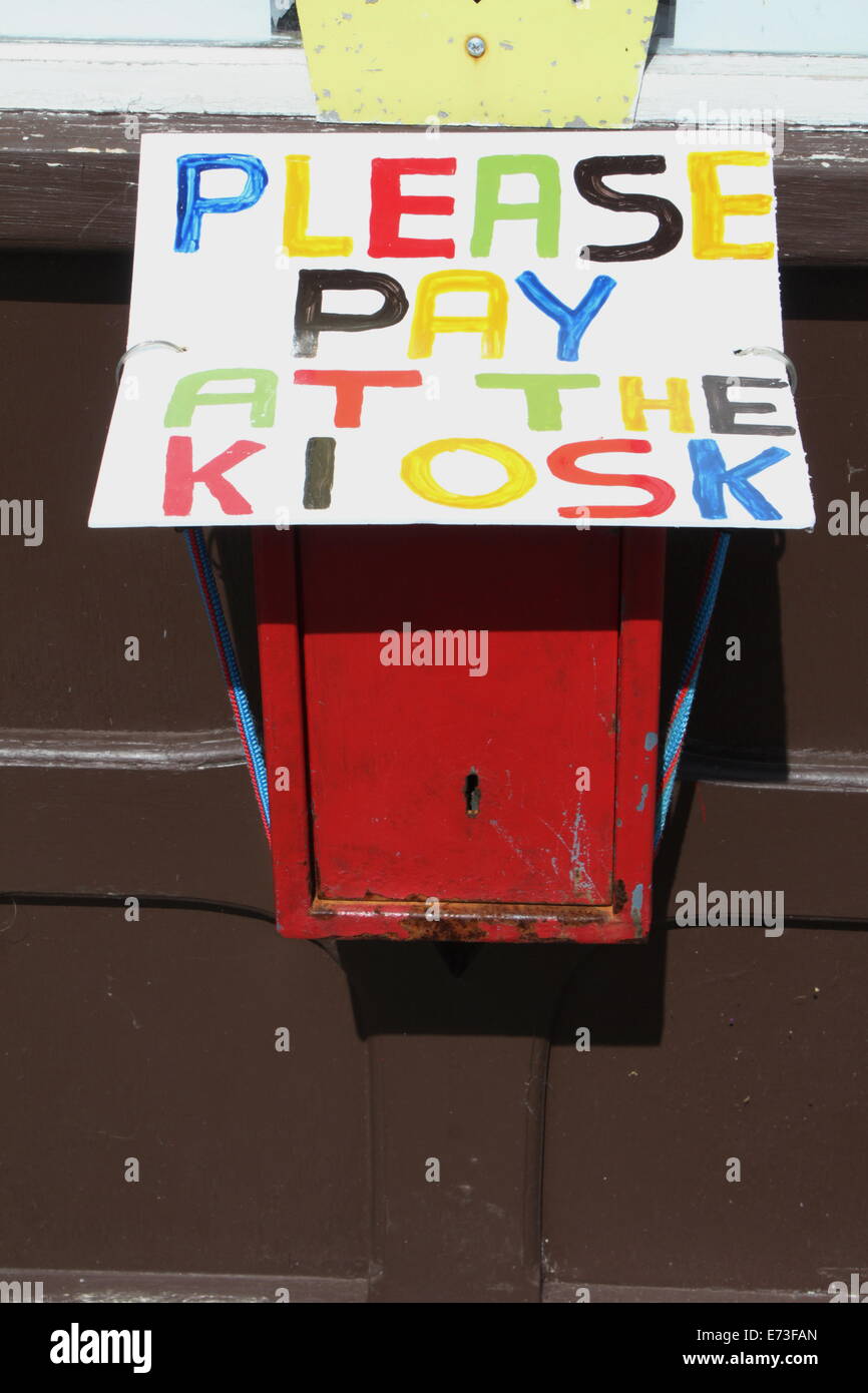 colourful handmade please pay at kiosk sign on pier in bangor wales ...