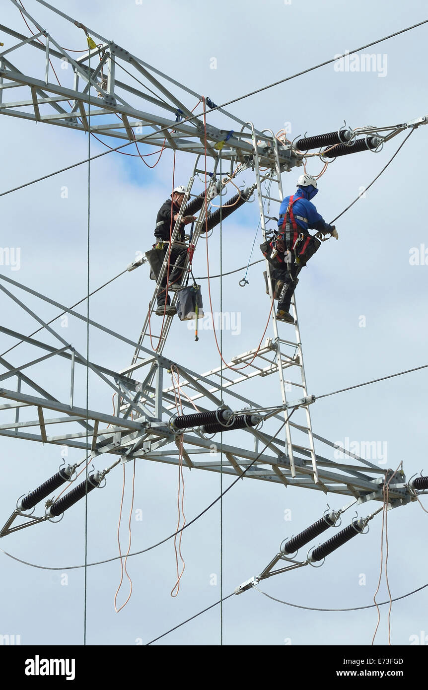 Technicians work on high voltage power lines in Ludwigsburg, Germany ...