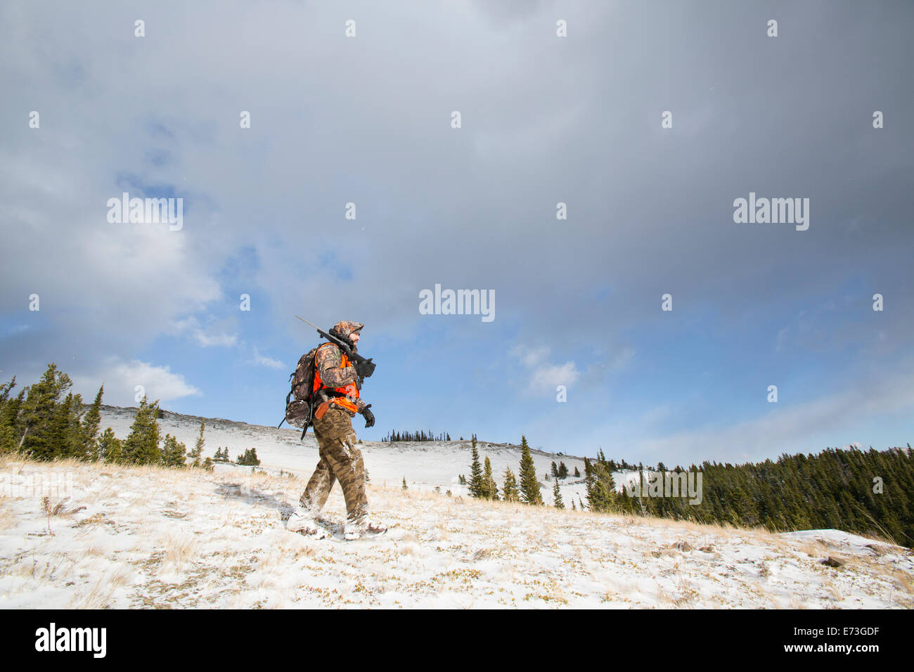 A male hunter at sunrise in the snow Stock Photo - Alamy
