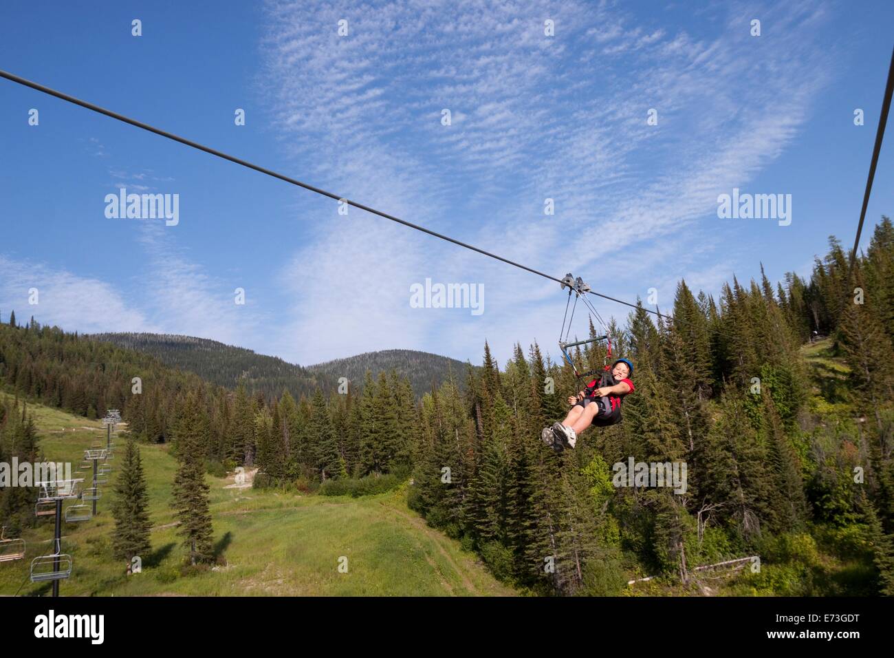 A young boy on a zip line tour in Whitefish, Montana Stock Photo - Alamy