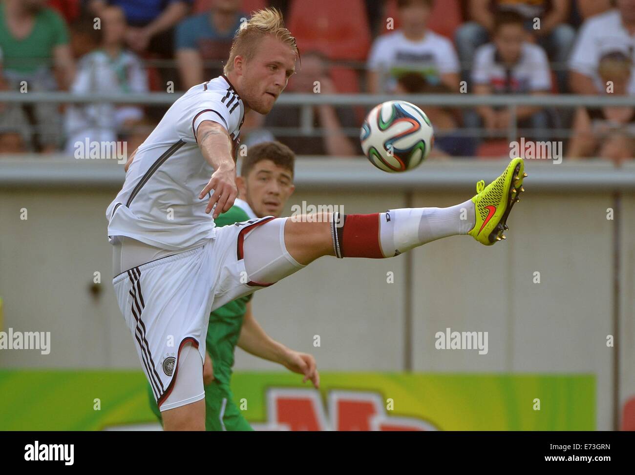 Germany's Philipp Hofmann (L) and Ireland's Sean Long vie for the ball ...