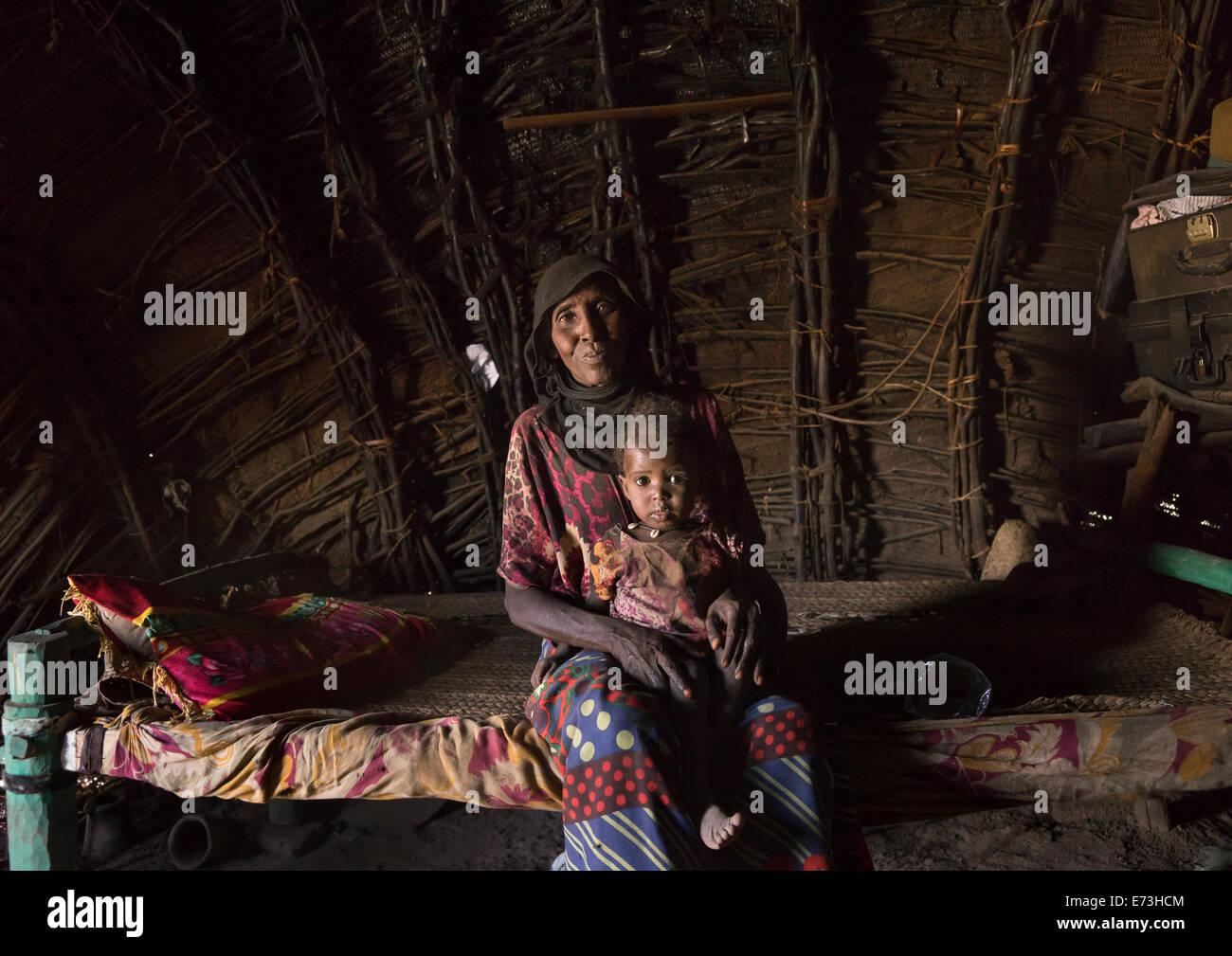Afar Tribe Mother And Her Daughter Inside Her House, Afambo, Ethiopia ...