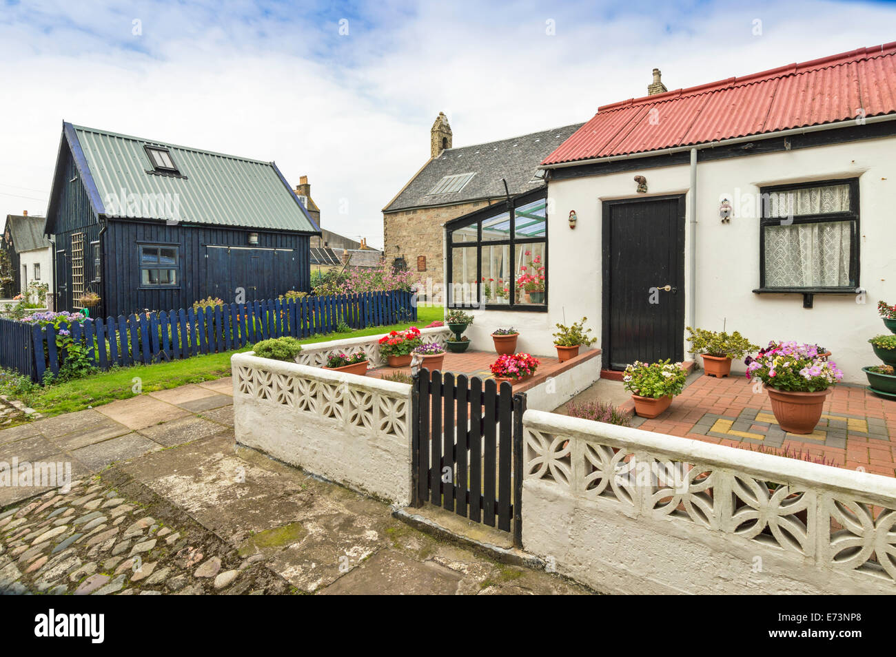 FOOTDEE OR FISHING VILLAGE IN ABERDEEN HARBOUR FLOWERS IN THE TUBS AND ...
