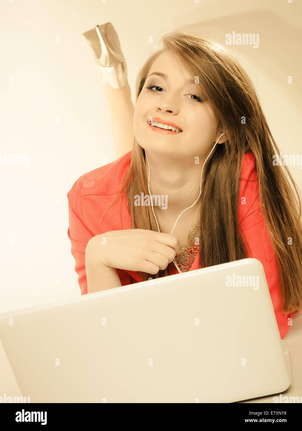 Girl with earphones and computer listening to music Stock Photo - Alamy