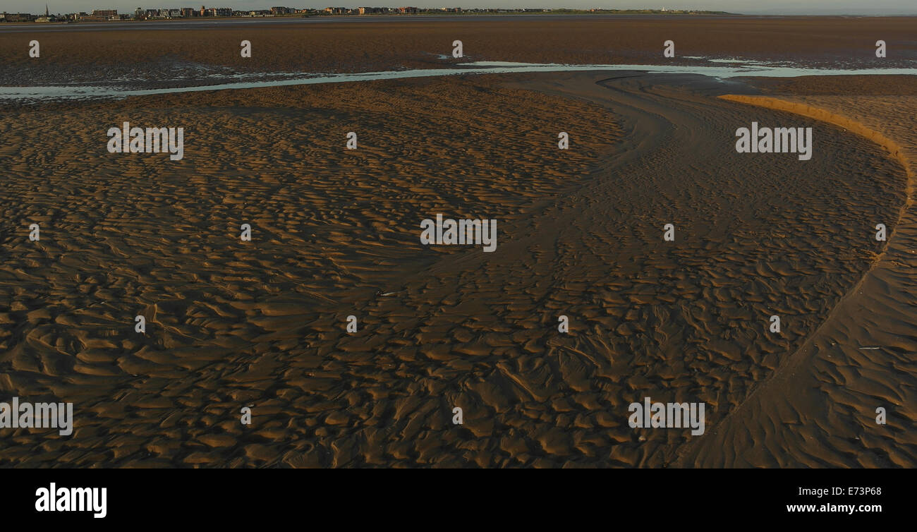 Water long narrow shallow pool crossing beach mid distance view hi-res ...